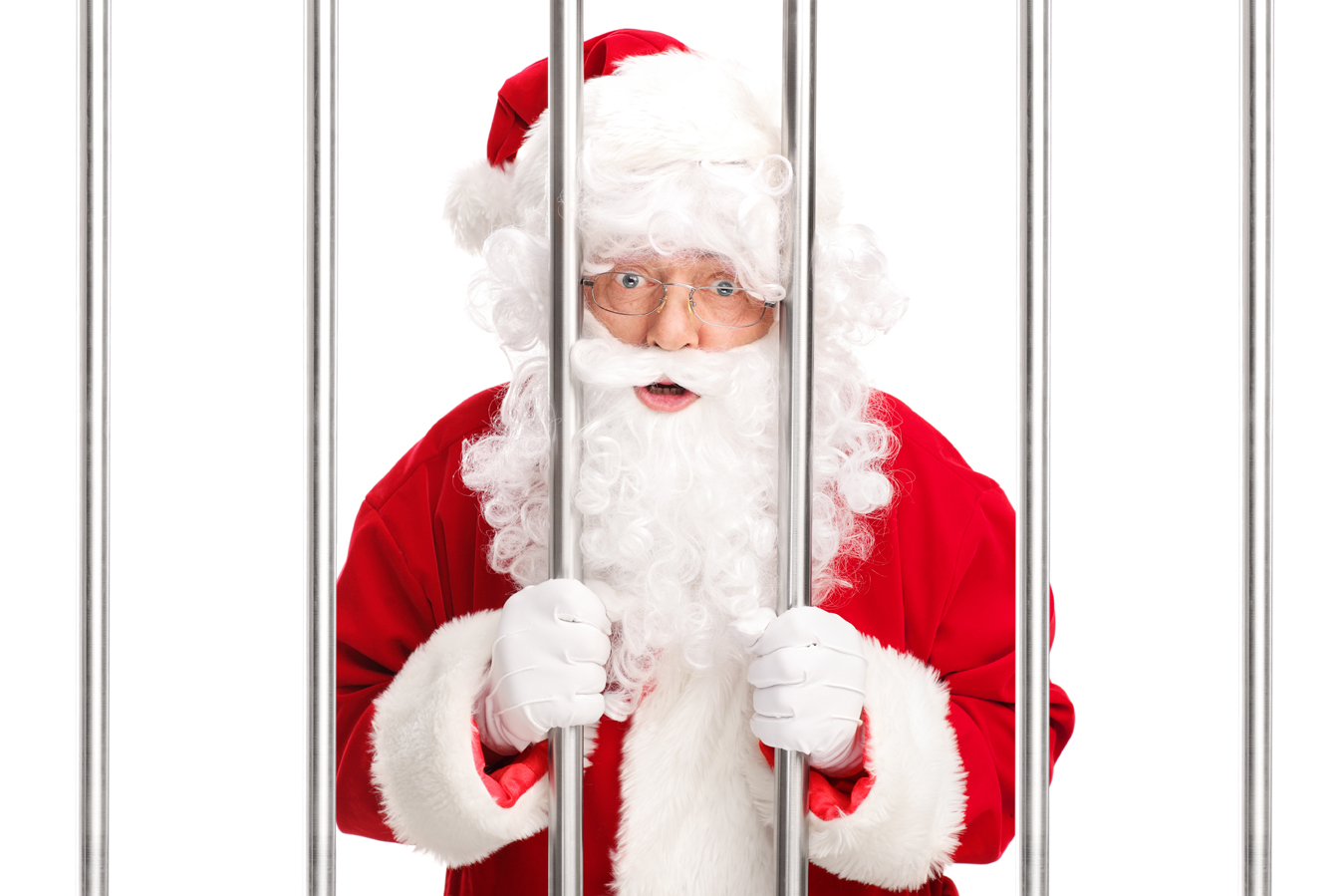 Sana Claus standing behind bars in jail - Freedom Bail Bonds
